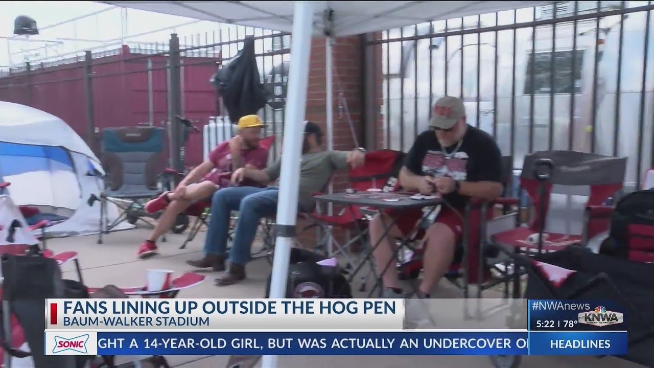 Hogs baseball fans lining up outside The Hog Pen - YouTube
