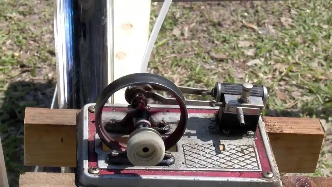 Trash can lid powers a steam engine parabolic mirror - YouTube