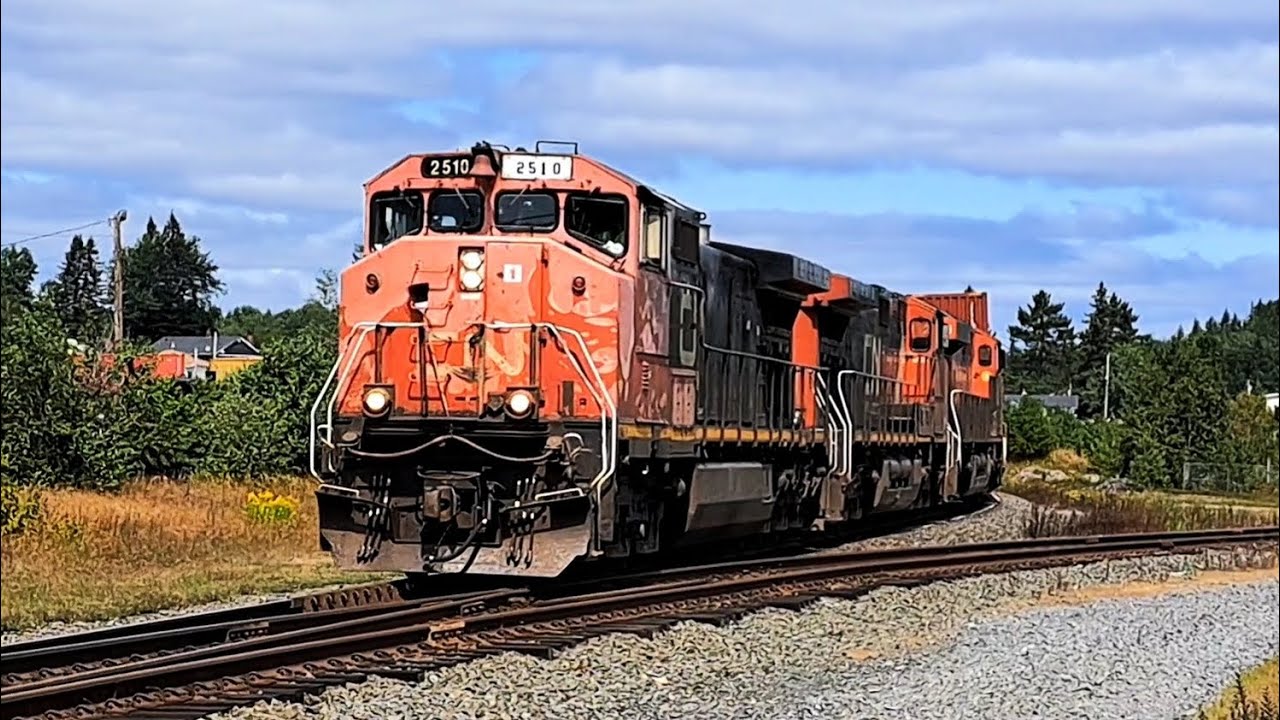 RARE! CRUSTY CANADIAN CAB DASH 9 LEADS TRIPLE HEADER ON CN STACK TRAIN ON THE CURVE AT CAPREOL ...