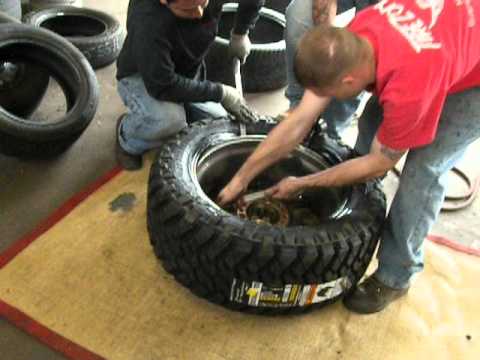 how to change a tire by hand 20111 - YouTube
