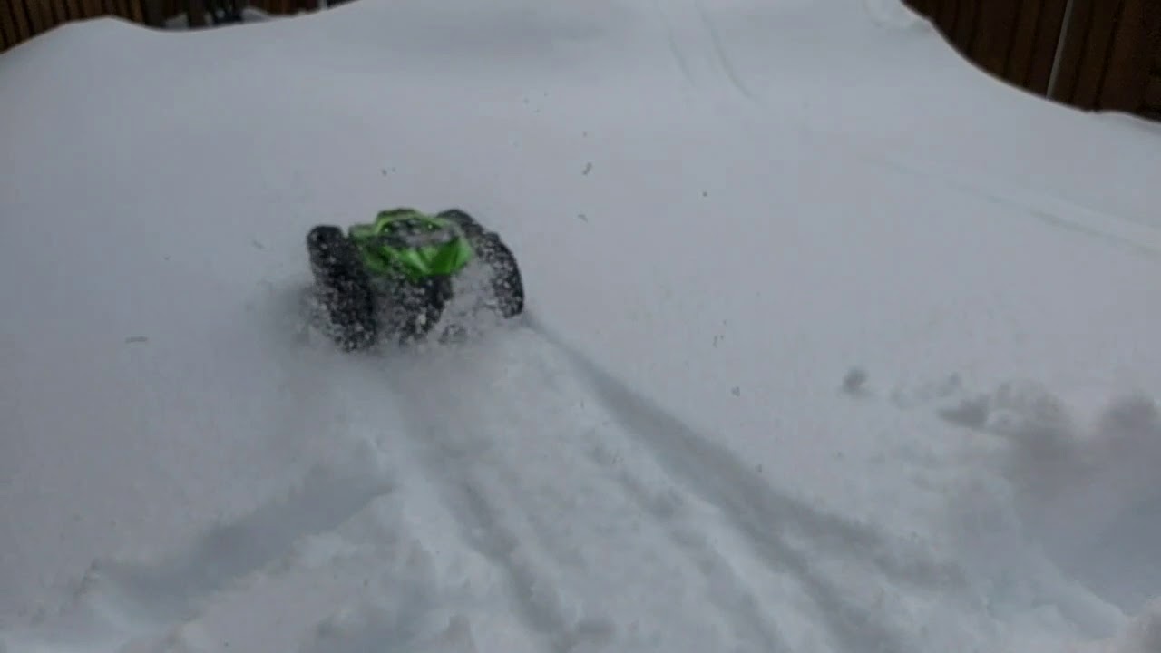 Remote controlled car in the snow, snowmobiles, belts - YouTube