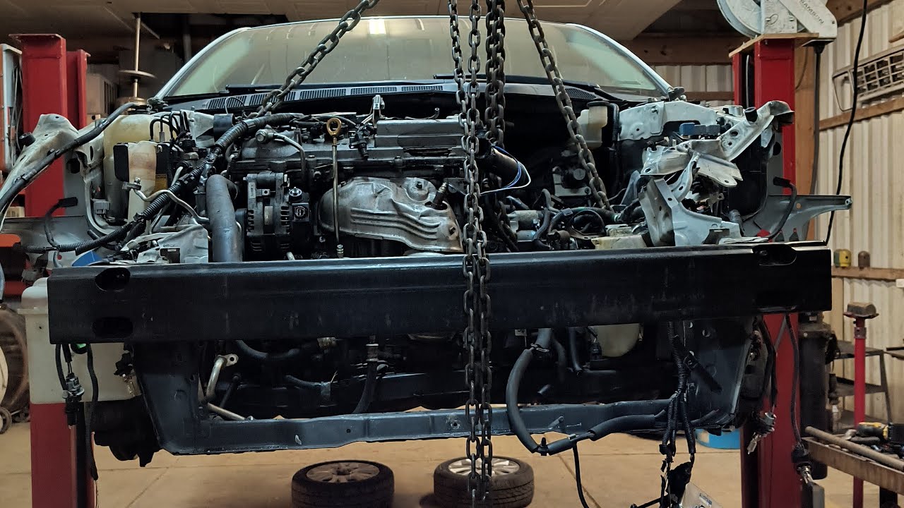 attempting to drop engine and transmission out of a vehicle - YouTube