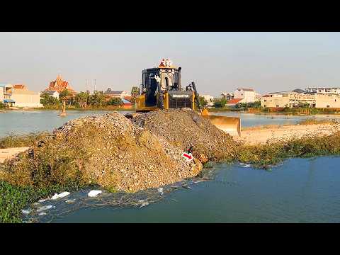 Up new start landfill delete flooded forest connect done by SHANTUI C3 pour stone with dump truck