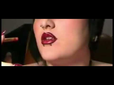 Smoking woman with red lipstick smoking a 120 close up 
