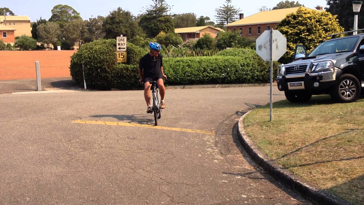 Seventy Year Old Riding Bicycle Backwards While Sitting on Handlebars ...