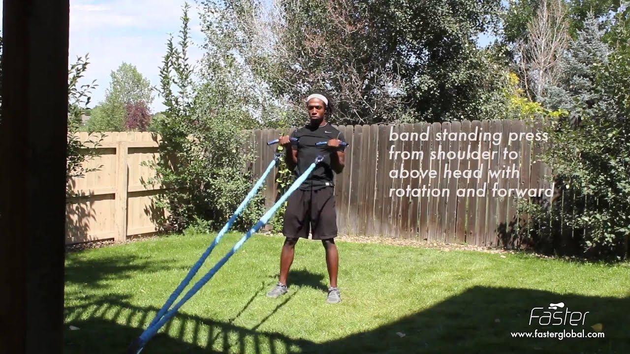 band standing press from shoulder to above head with rotation and ...