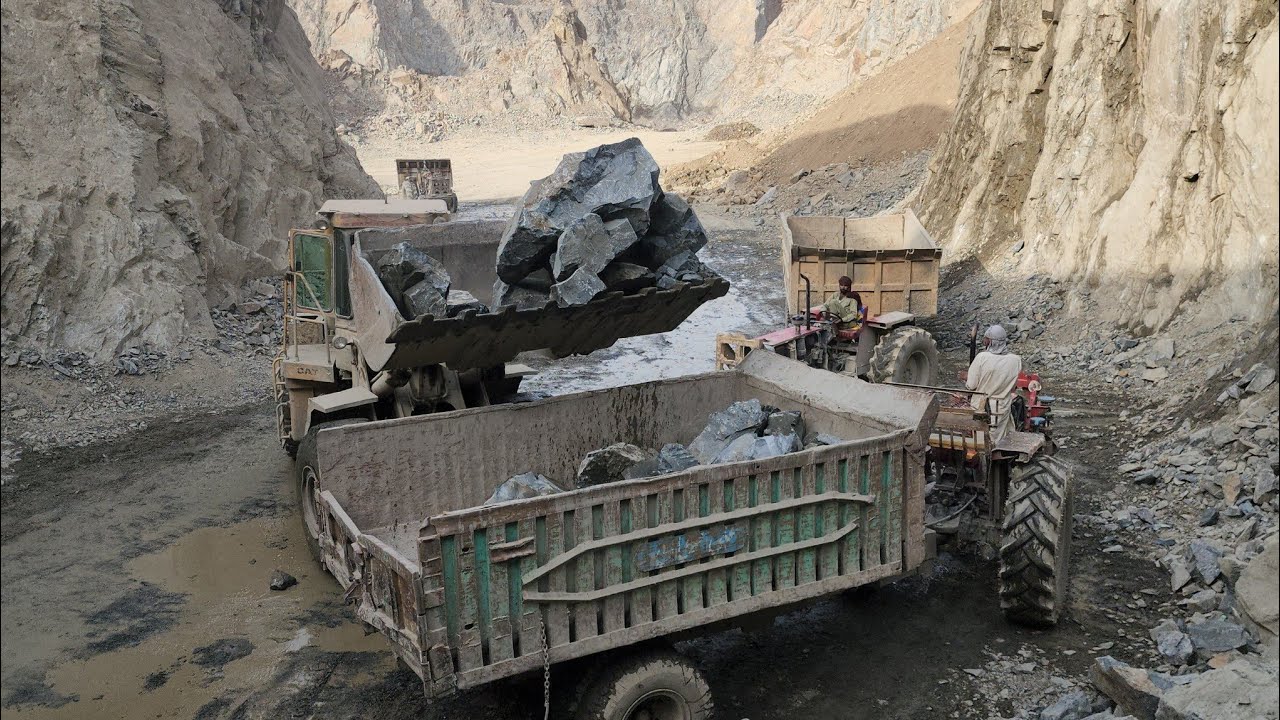 Massive Rock Loading Show by Powerful 966E Wheel Loader: Loading Huge ...