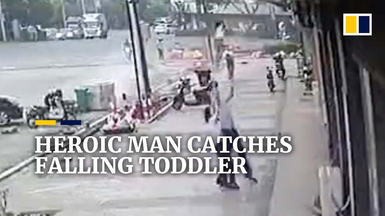 Heroic man catches falling toddler in China - YouTube