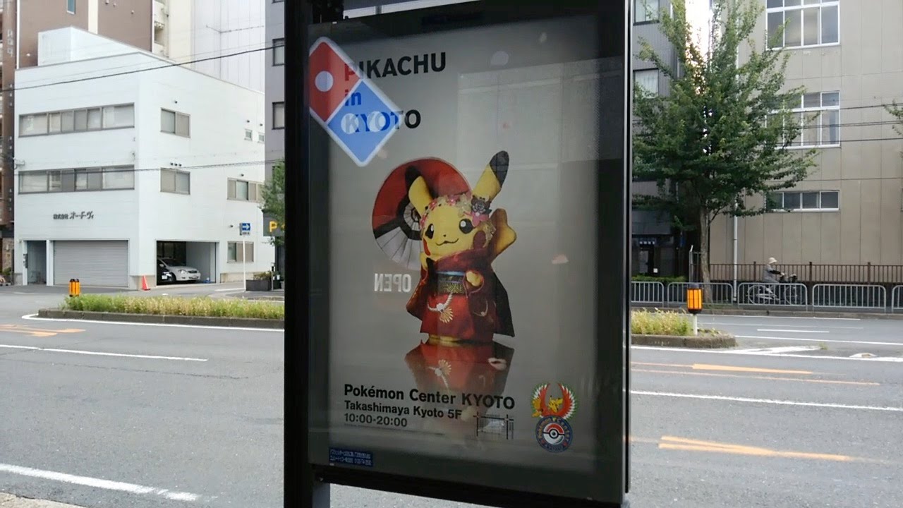 Pikachu in the bus stop. Advertisement of Pokemon center Kyoto in ...