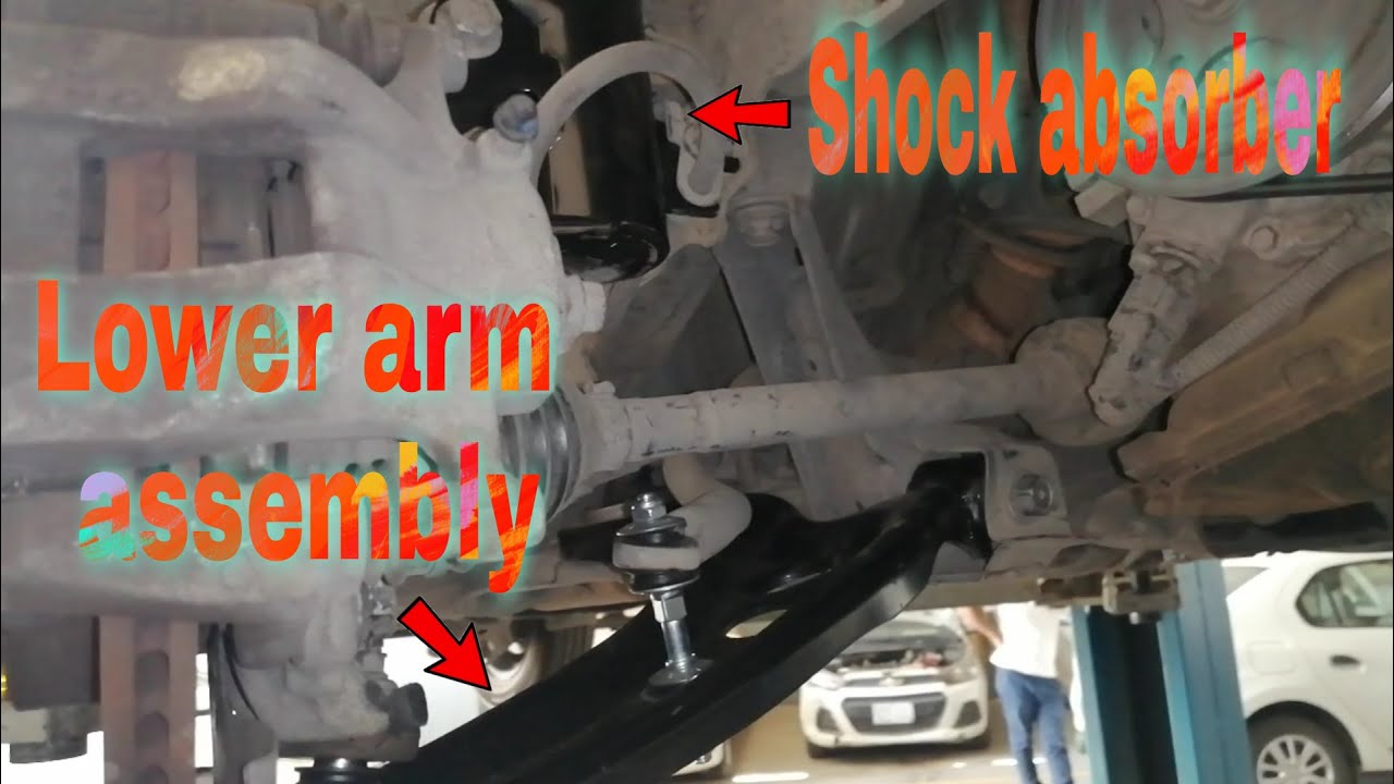 How to replace toyota yaris shock absorber and lower arm assembly - YouTube
