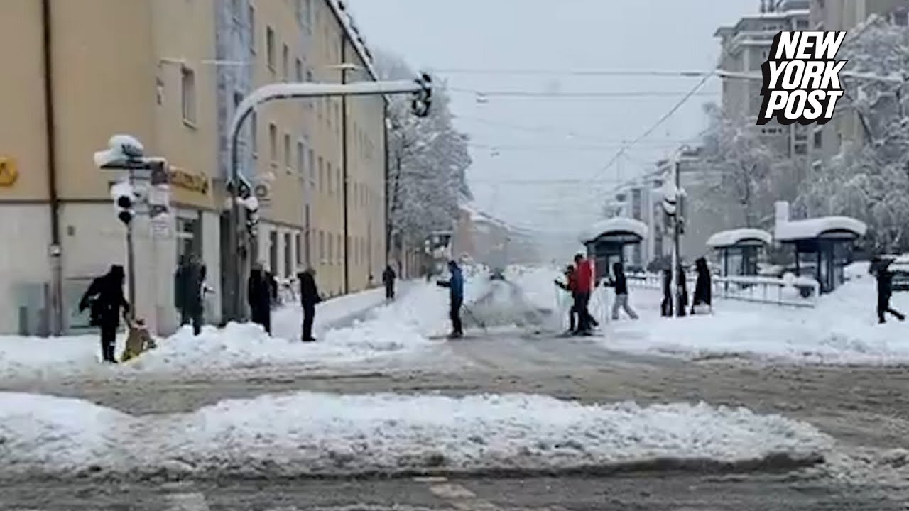 Munich Locals Wade Through Heavy Snow in Skis - YouTube