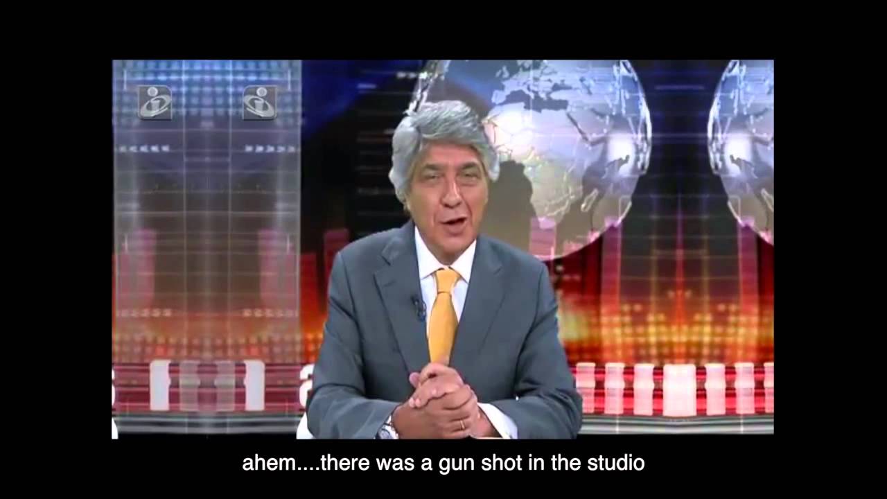 tv newscaster reacts to gun shot on the set, keeps going with the news ...
