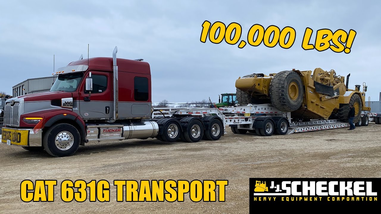Transporting a CAT 631G Scraper - YouTube