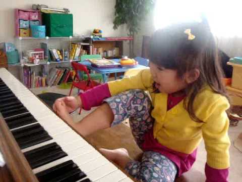 Zoei Trying to Play Piano with Her Toes - YouTube