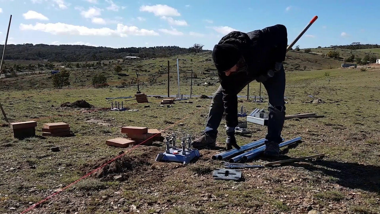 Measure, string line, level and set up surefoot footings for shipping ...