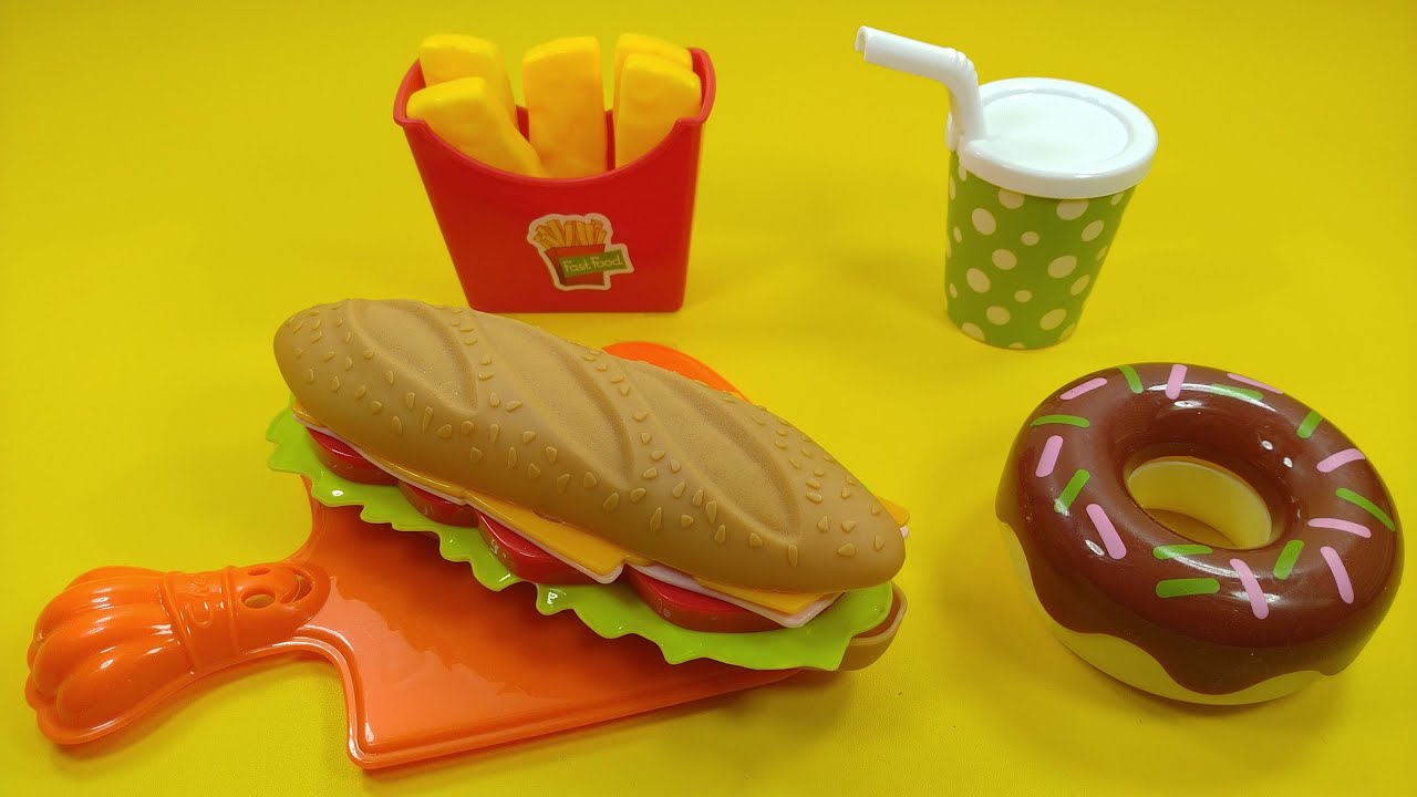 Toy sandwich, donuts, cake, juice, french fries. Toy food for kids. Fun ...