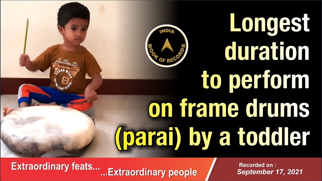 Longest duration to perform on frame drums parai by a toddler - YouTube