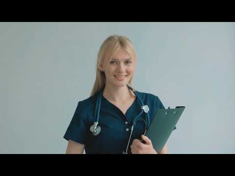 Portrait Of Young Pretty Blonde Female Nurse Care Taker Smiling