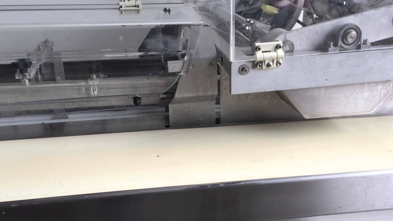 Freemantle semi automatic cartoner - YouTube