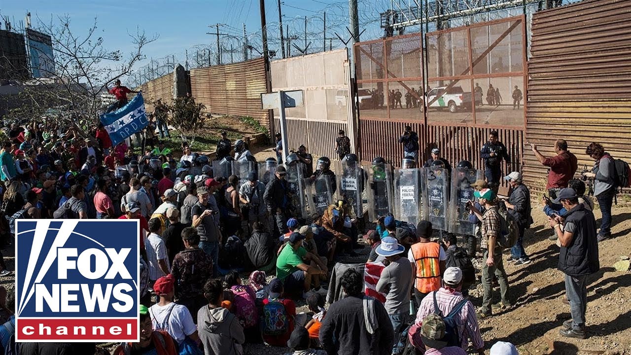 Pregnant migrant scales border wall, gives birth in US - YouTube