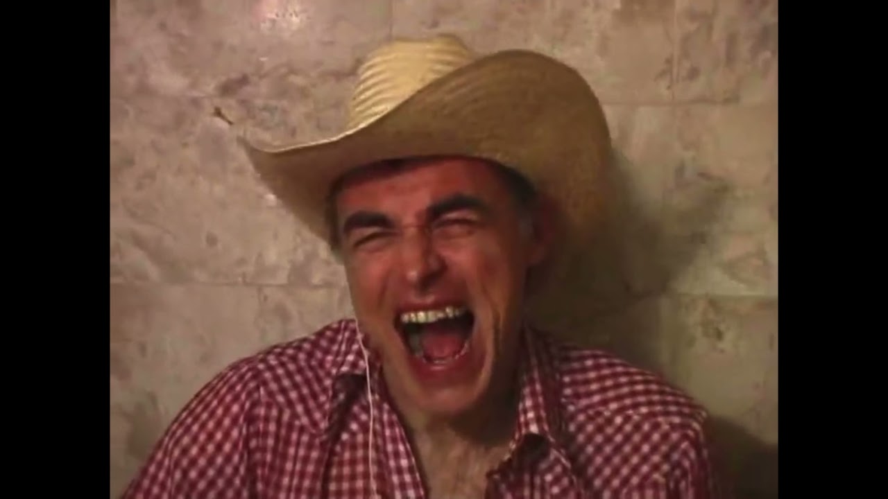 Ned (Miles Dougal) singing “Bailey’s Harbor” in Schoof (2008, dir ...