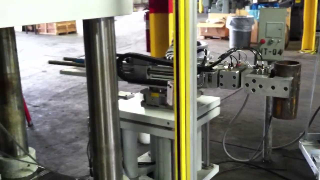 Swage press with robotic loader and unloader - YouTube