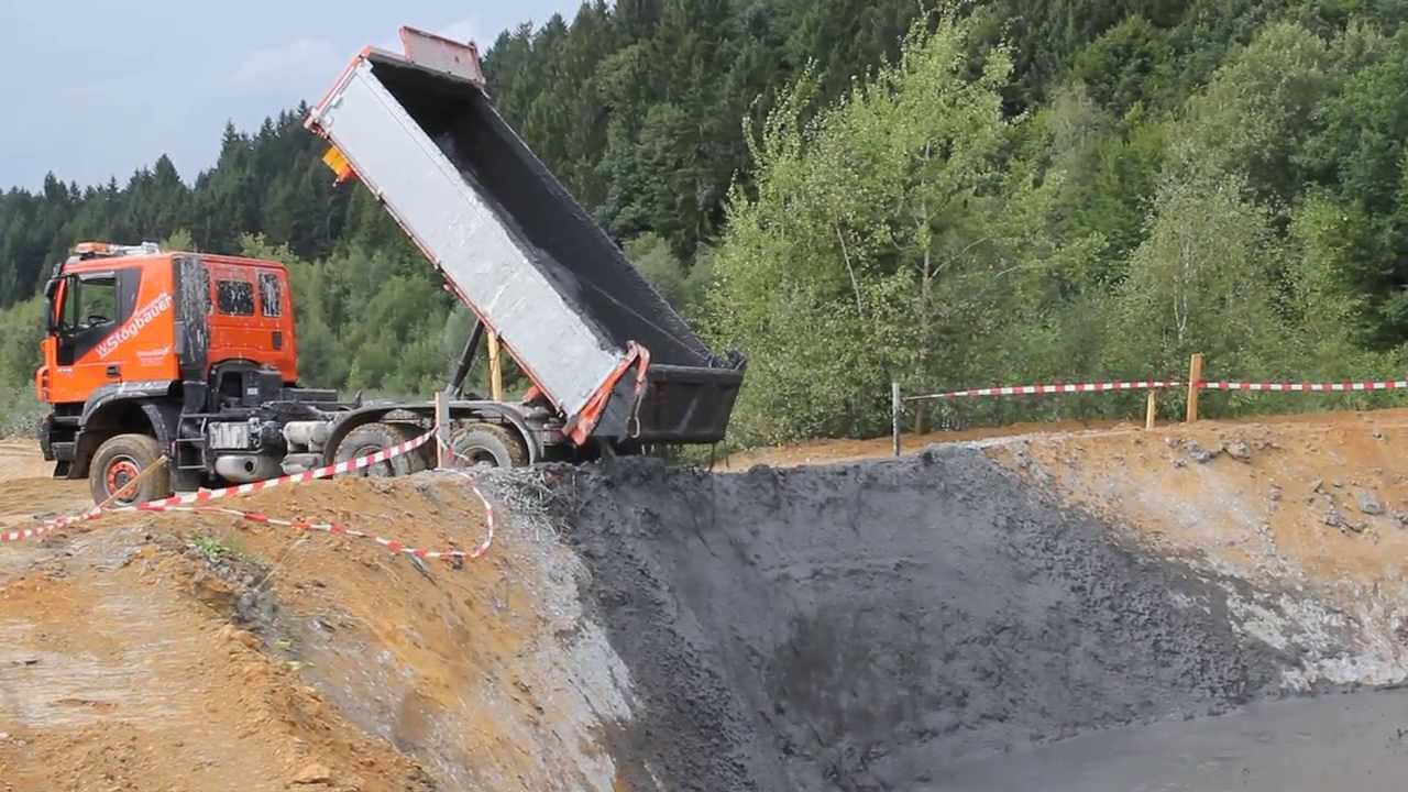 Iveco truck dumping graphite mud - YouTube