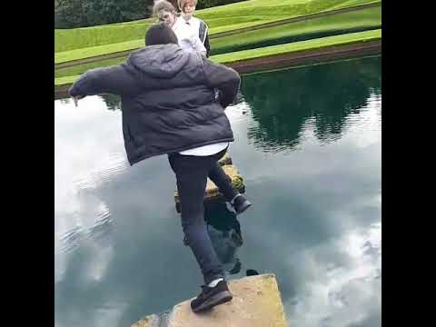 Kid falls into pond and drags other people in with him - YouTube