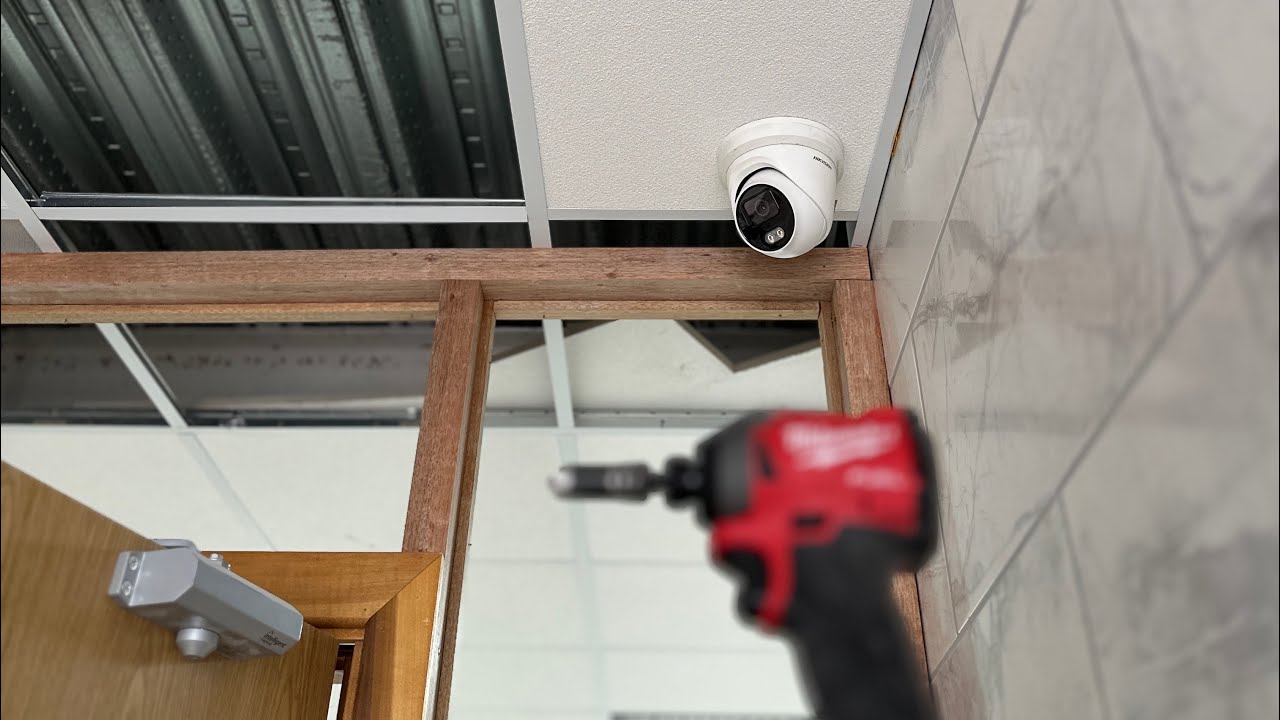 Electrical and security engineer fitting CCTV - YouTube