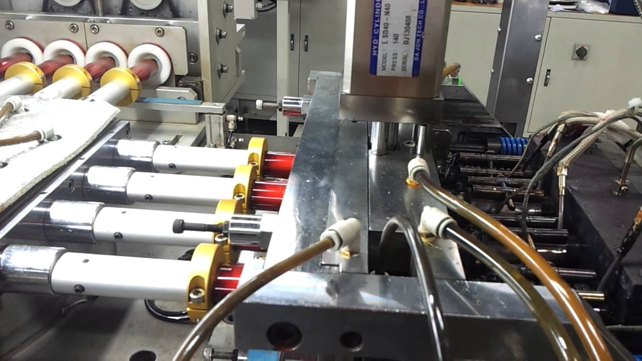 30 dia. laminate cosmetic oval tube heading injection machine - YouTube