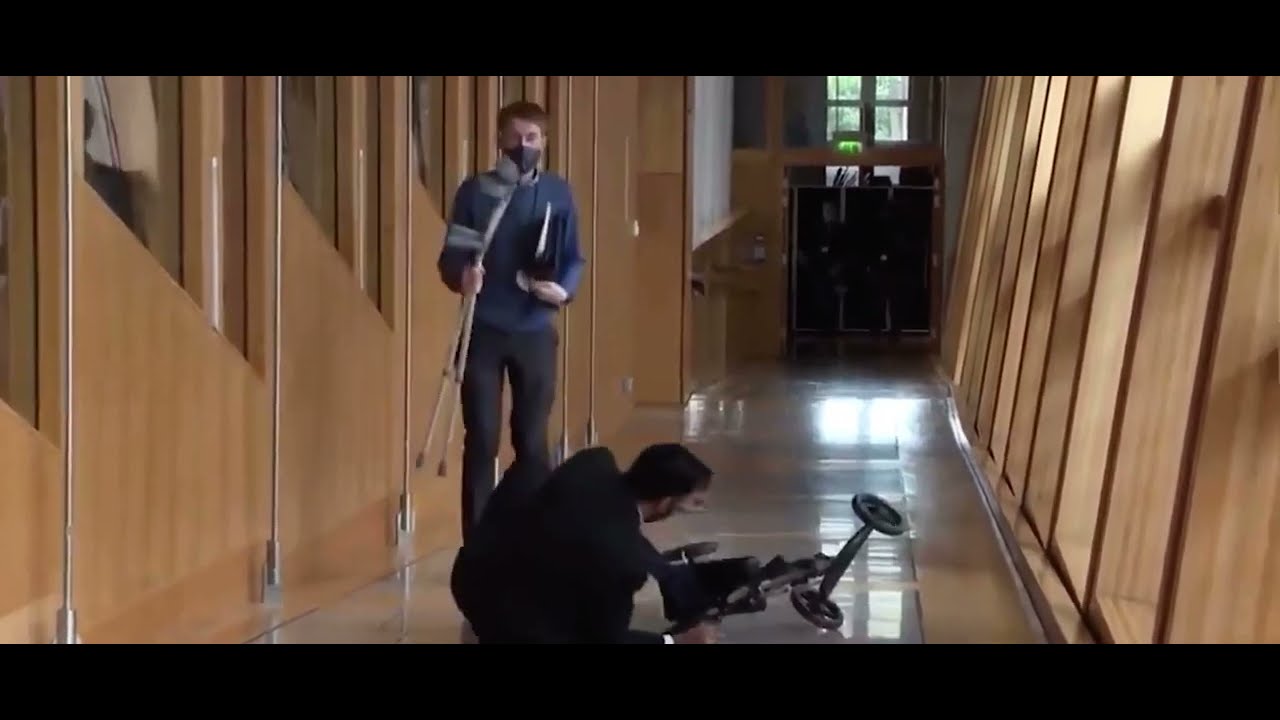 Humza Yousaf falls off scooter racing around parliament - YouTube