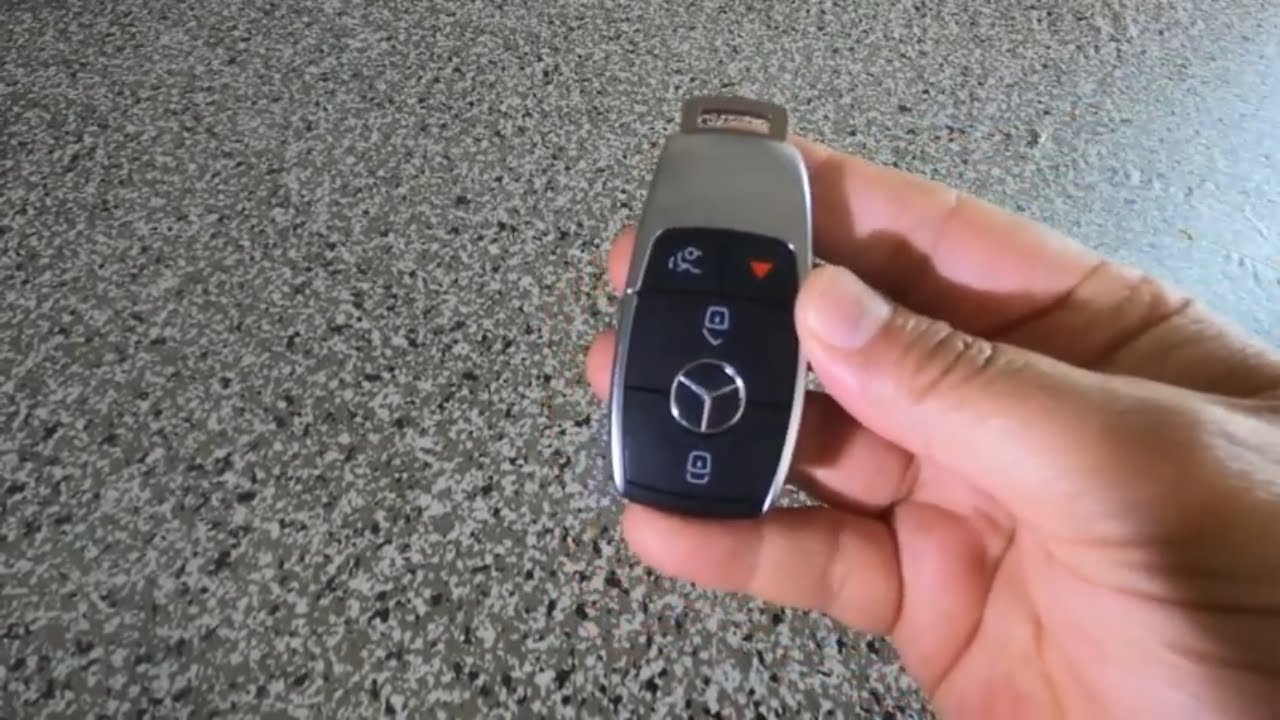 Changing battery in spring loaded Mercedes Benz key fob - YouTube