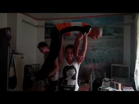 Strong Alyona overhead lift and carry an old man