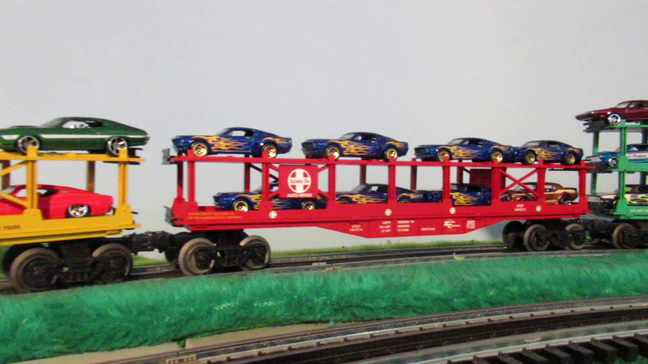 Lionel O gauge auto carriers with Hot Wheels in a fast moving freight ...