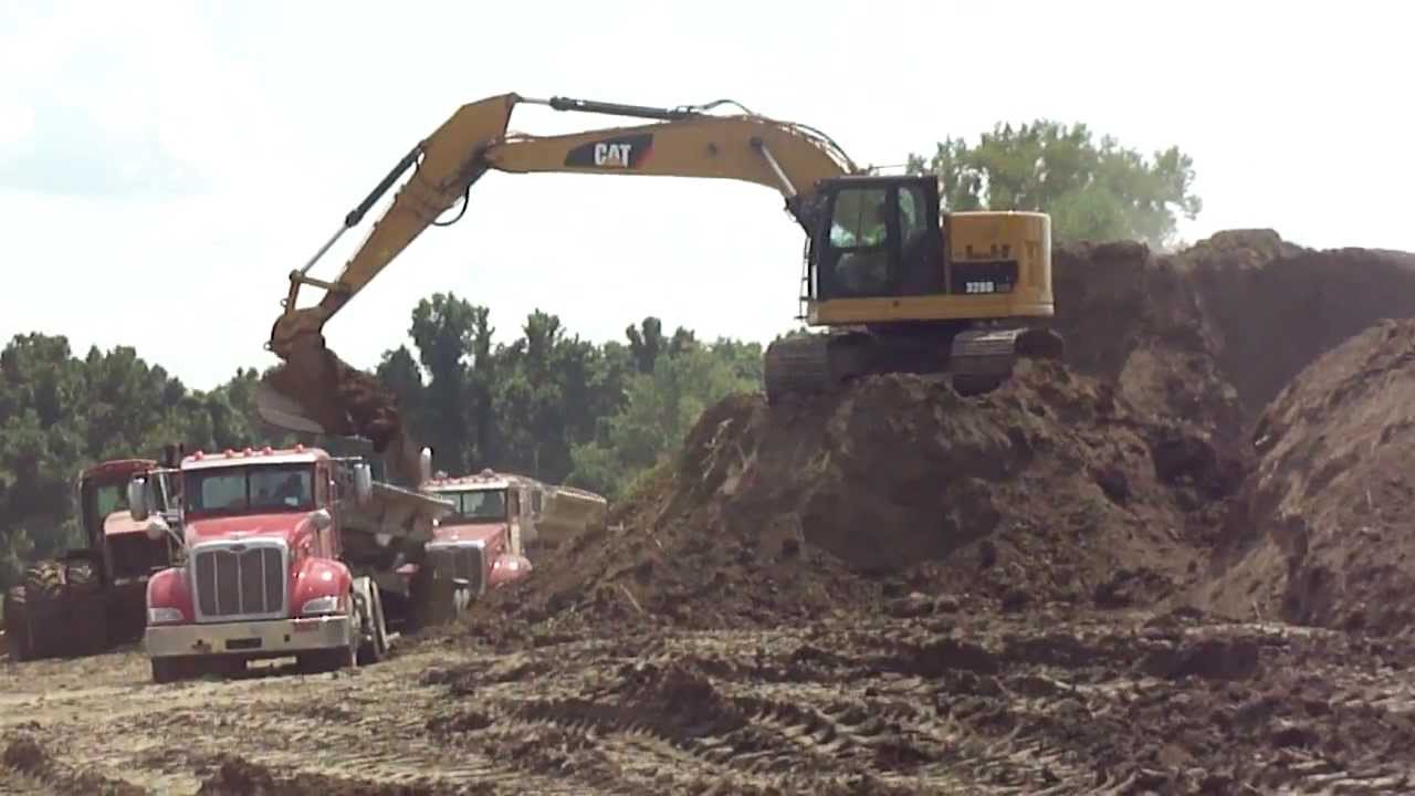 345CL CAT and CAT 328D Top Load over 30 Trucks - YouTube