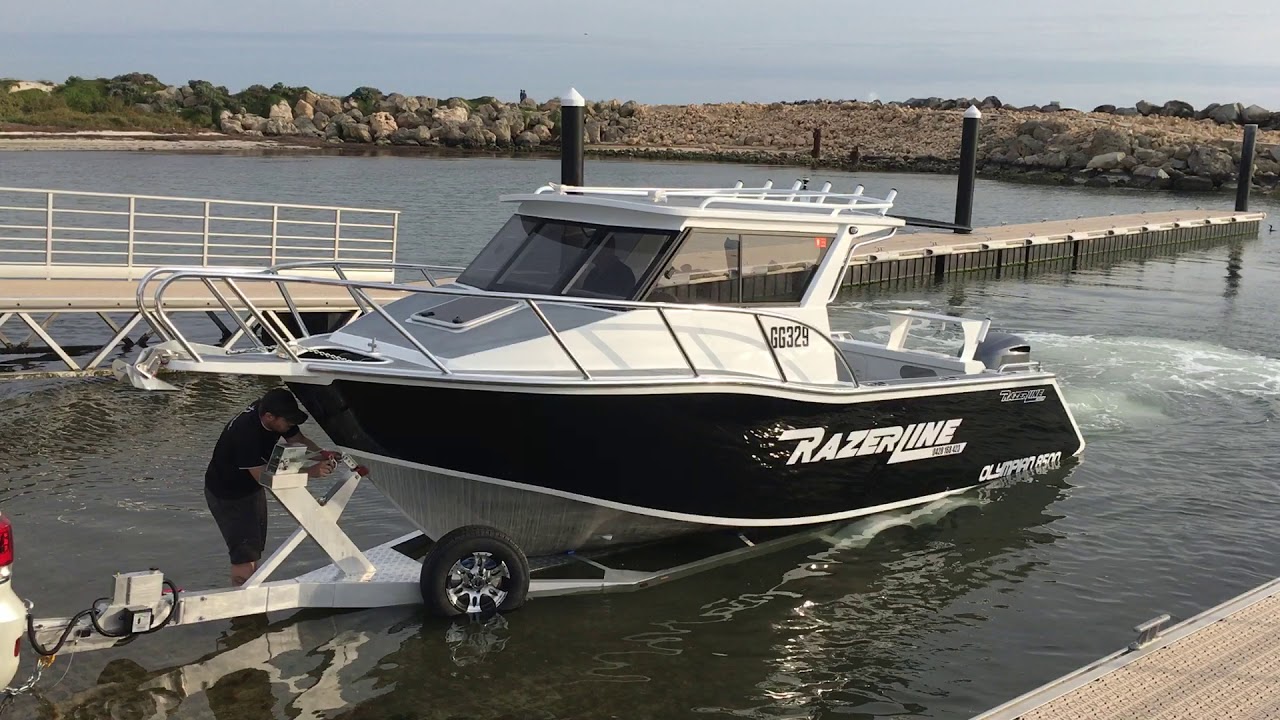 Razerline Olympian 7.6 m Hardtop driving on to custom Razerline trailer ...