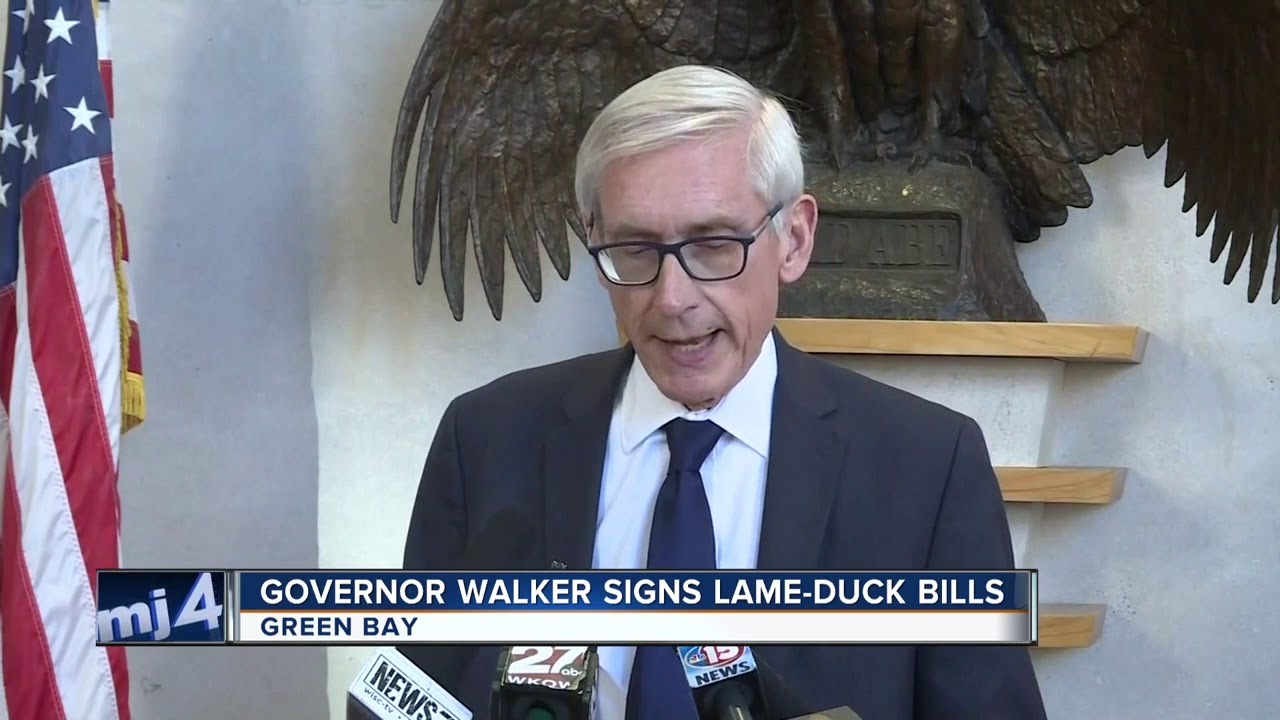 Walker signs lame-duck bills - YouTube