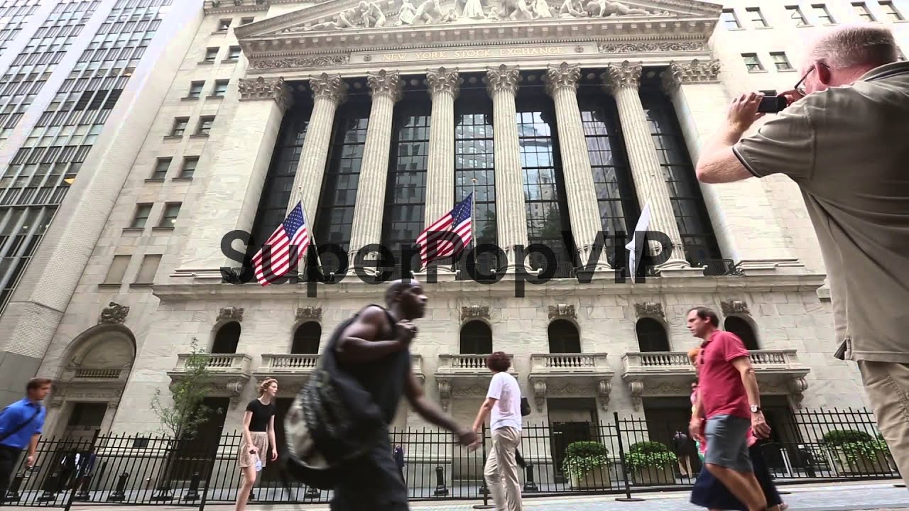 Low angle mid shot of NYSE. People pass through the iconi... - YouTube