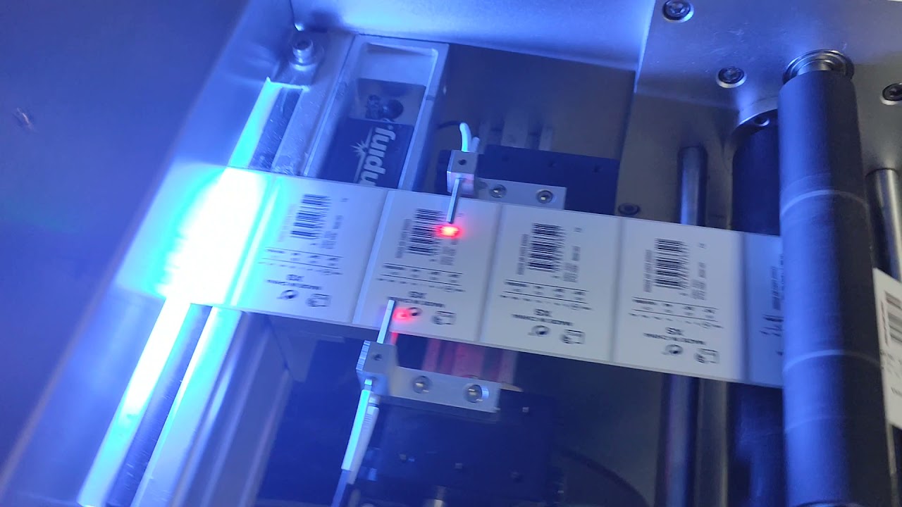 Automactic Roll encoding print and QC machine - YouTube