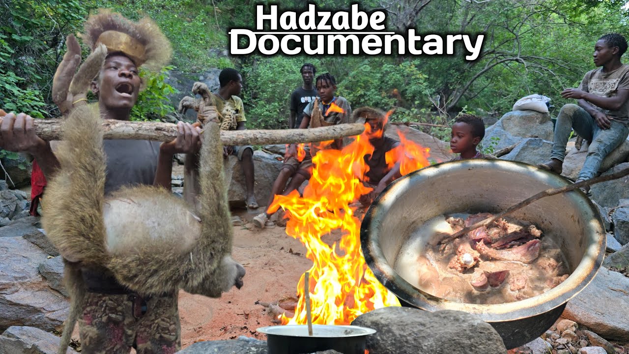 HADZABE Tribe hunting, cooking and eating a Huge baboon for Lunch ...