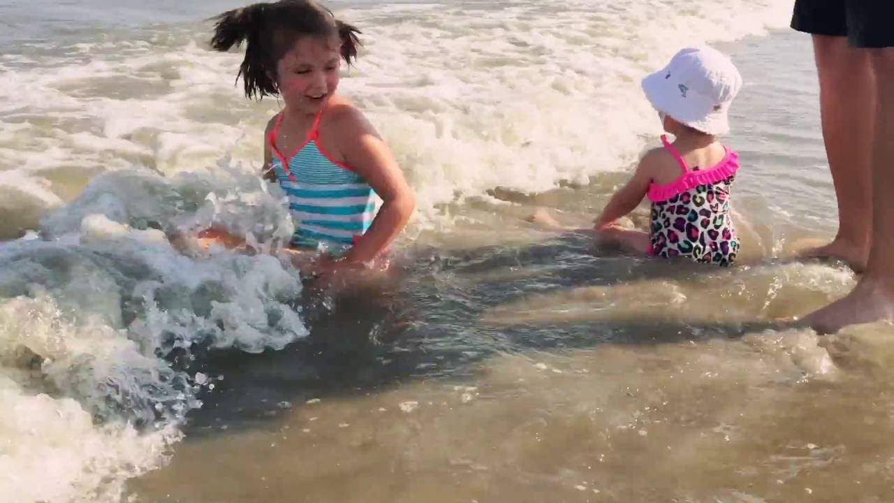 Playing in the ocean. - YouTube