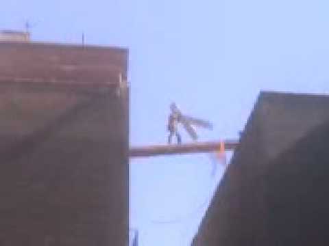 OSHA Violation: Worker uses ladder between two buildings - YouTube