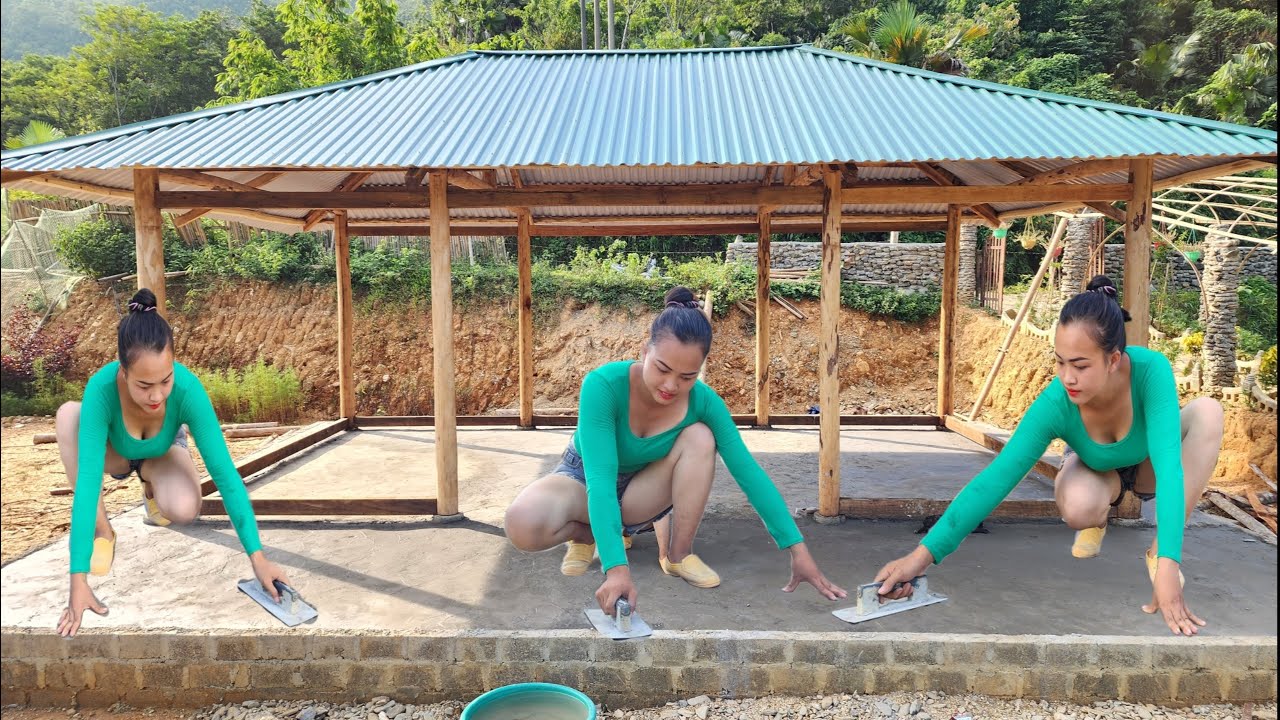 Construction of a new wooden house:Finishing the work of paving the ...