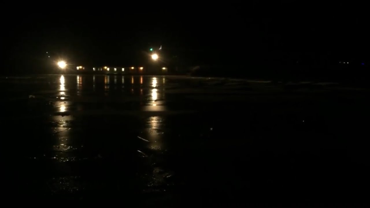Barge Spotlights Man On Bank From Icy Ohio River - YouTube