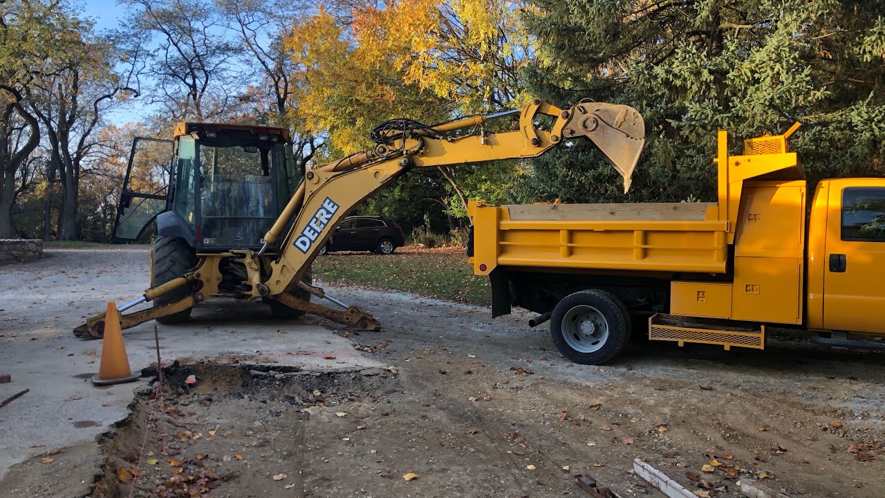 Digging out and braking asphalt - YouTube