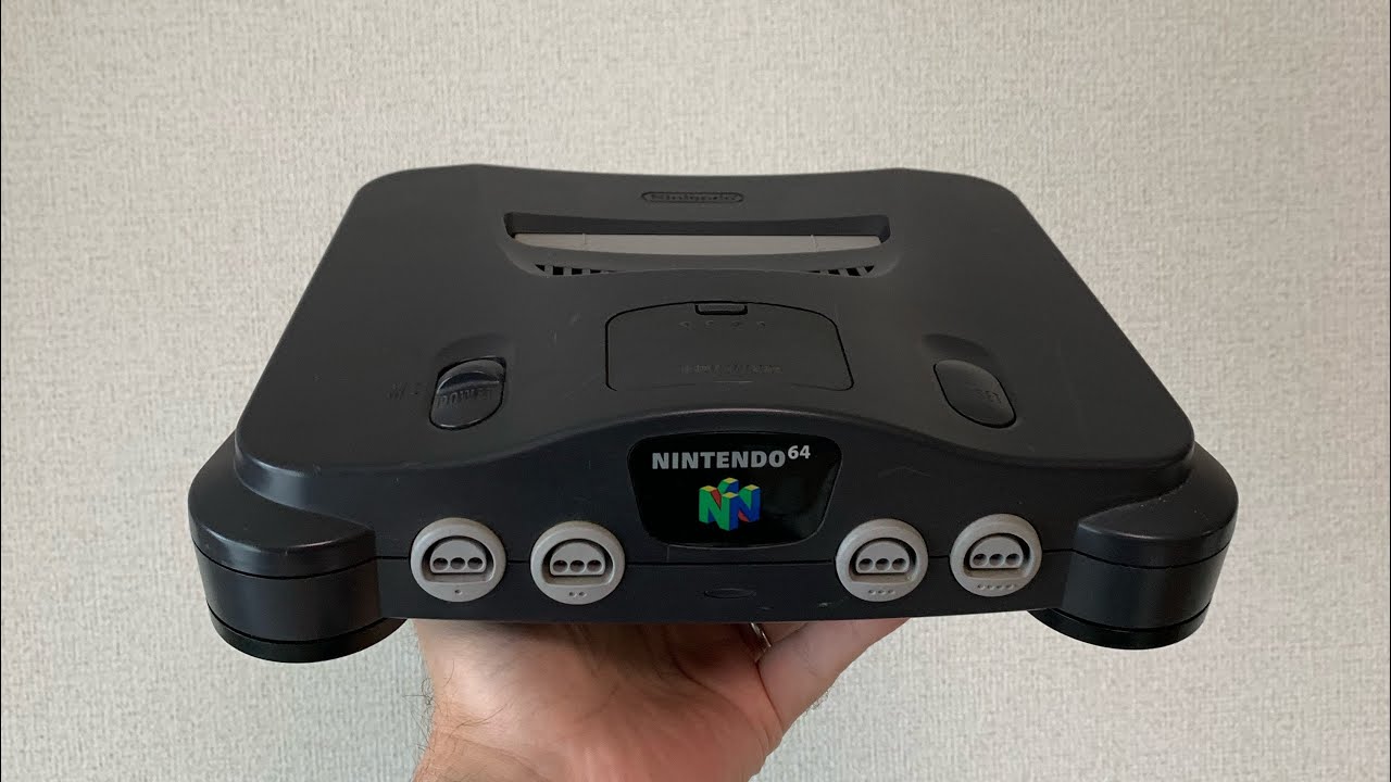 Nintendo 64 N64 Console with a broken hair clip jammed in the cartridge ...
