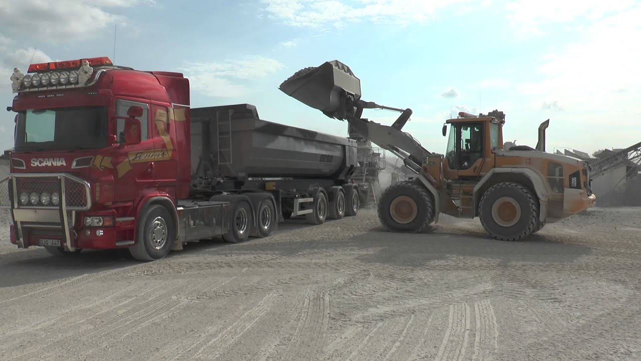 Scania truck is loaded by a Volvo L120G wheel loader 2013 - YouTube