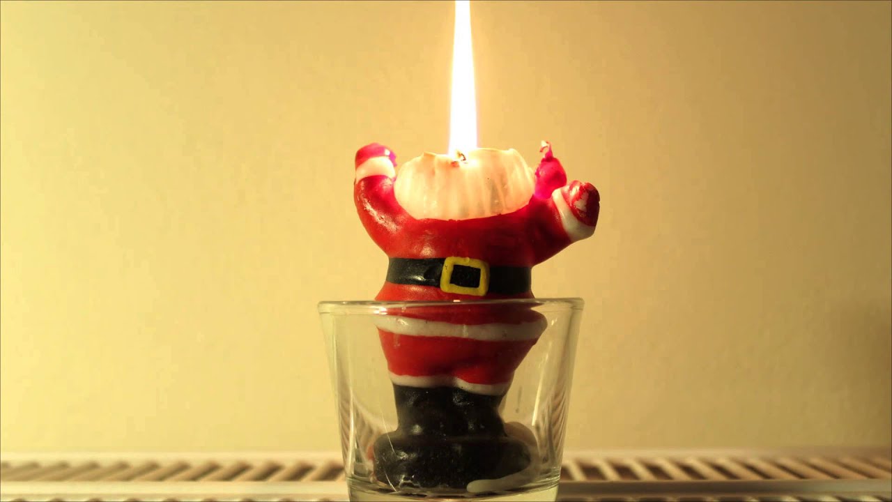 Time lapse santa claus candle burning - YouTube