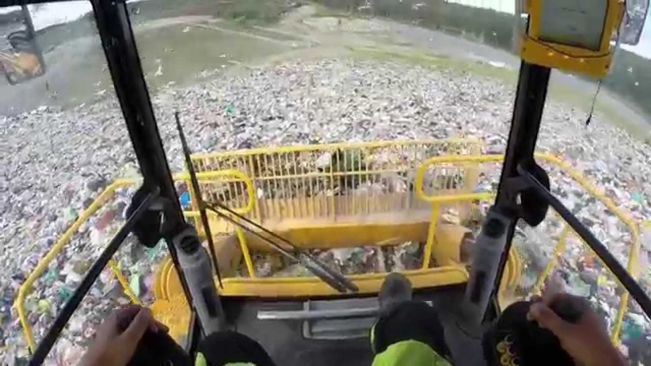 Operating TANA E320eco landfill compactor - YouTube