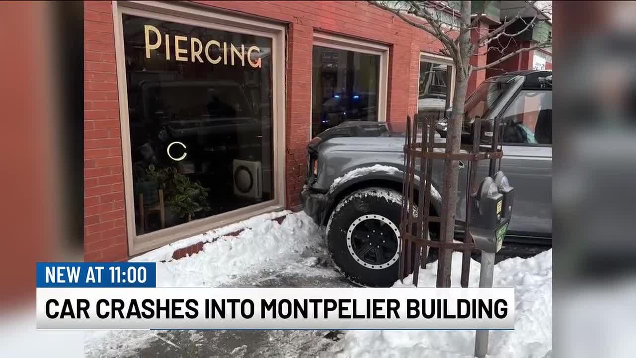 Car narrowly avoids crashing through building - YouTube